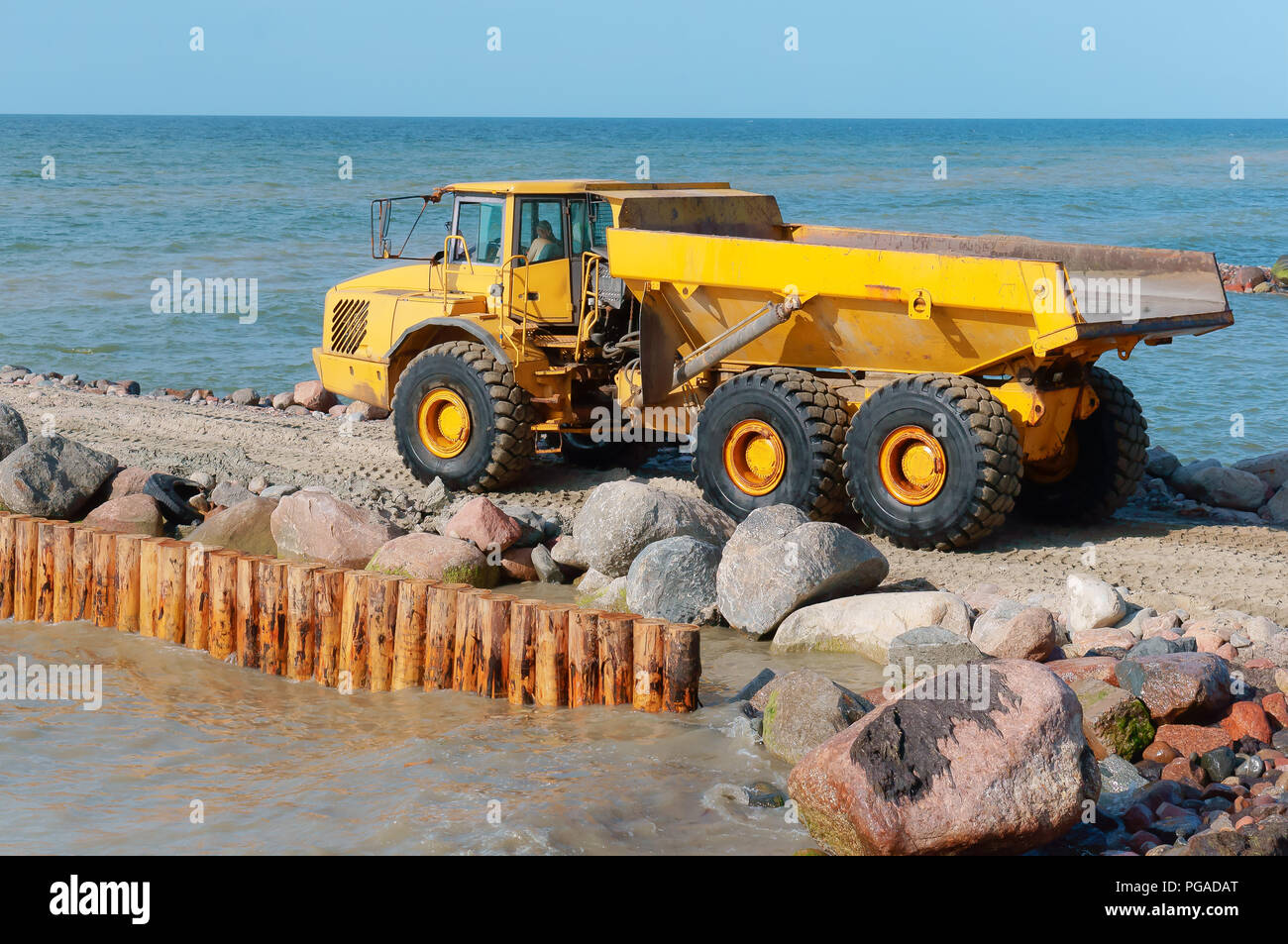 construction equipment on the shore, the construction of breakwaters ...