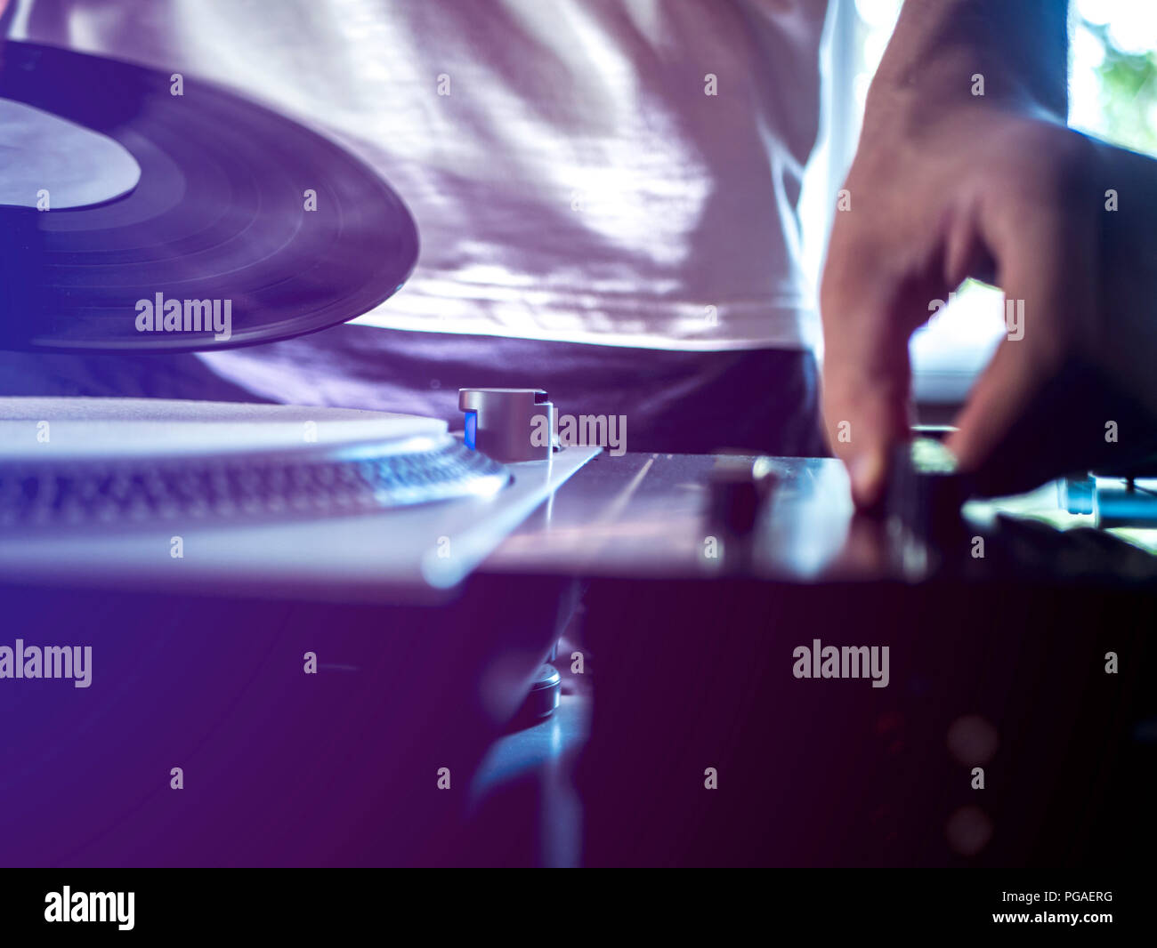 close up young dj playing modern music on professional equipment setup ...