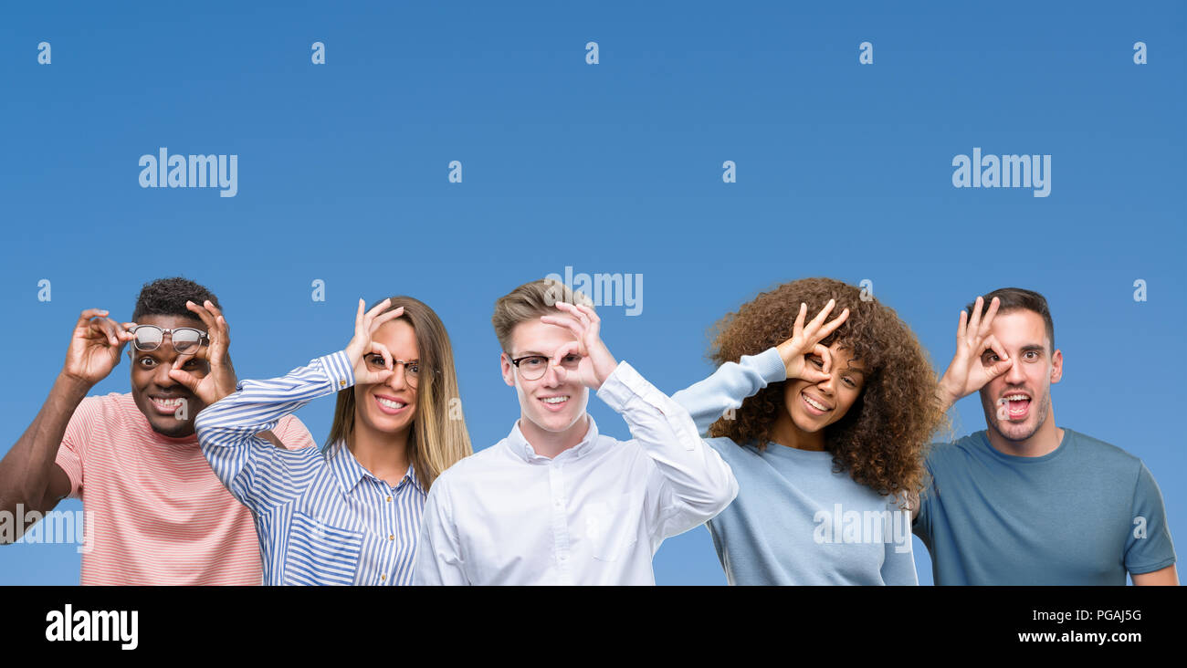 Composition of group of friends over blue blackground doing ok gesture ...