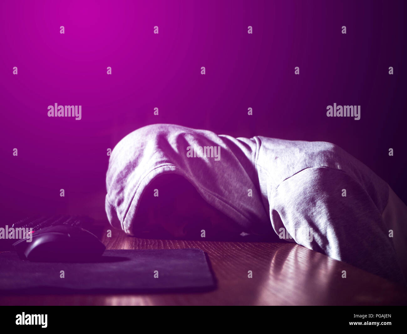 abstract anonymous person in the hood sleeping lying on the table in ...