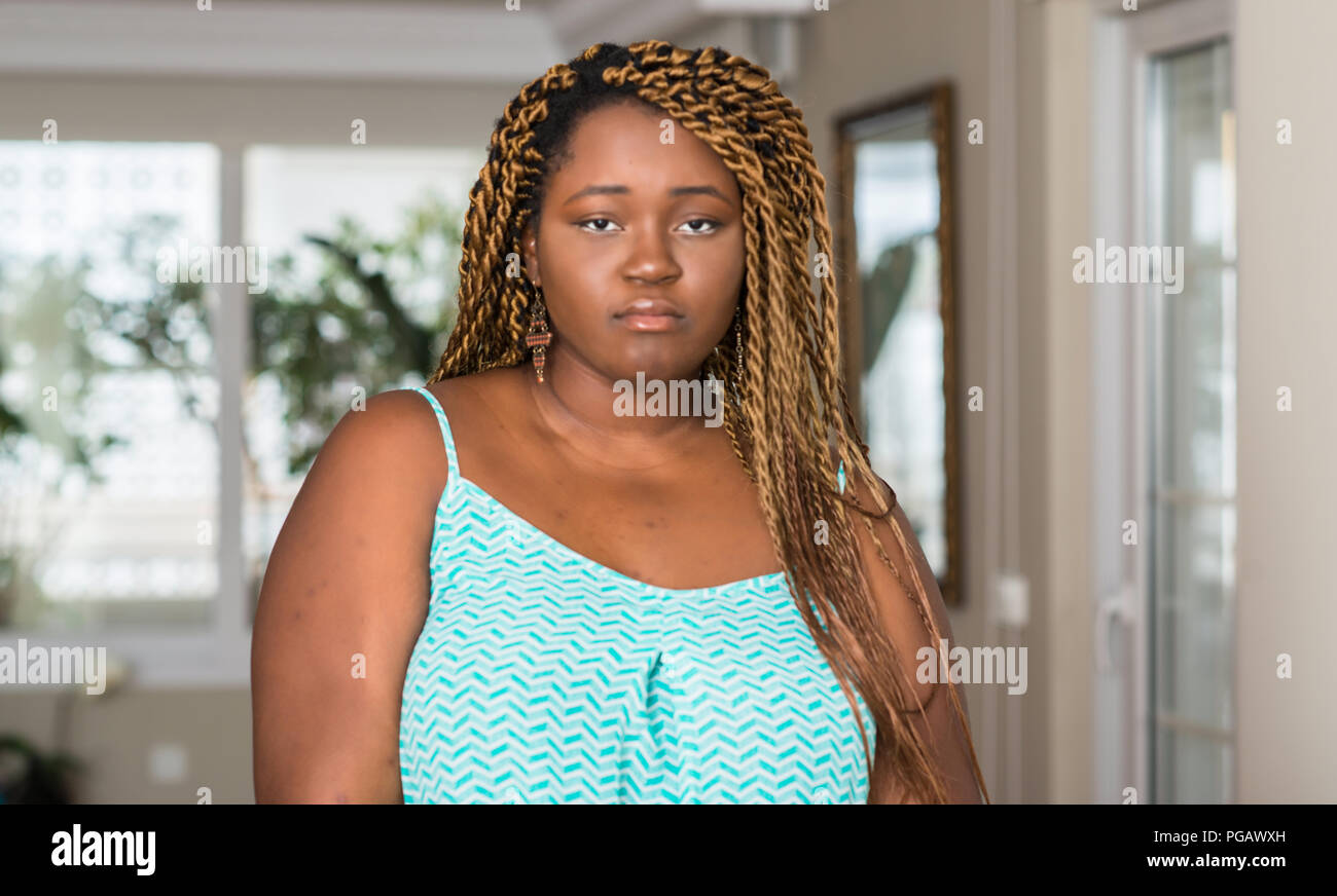 African american woman at home depressed and worry for distress, crying ...