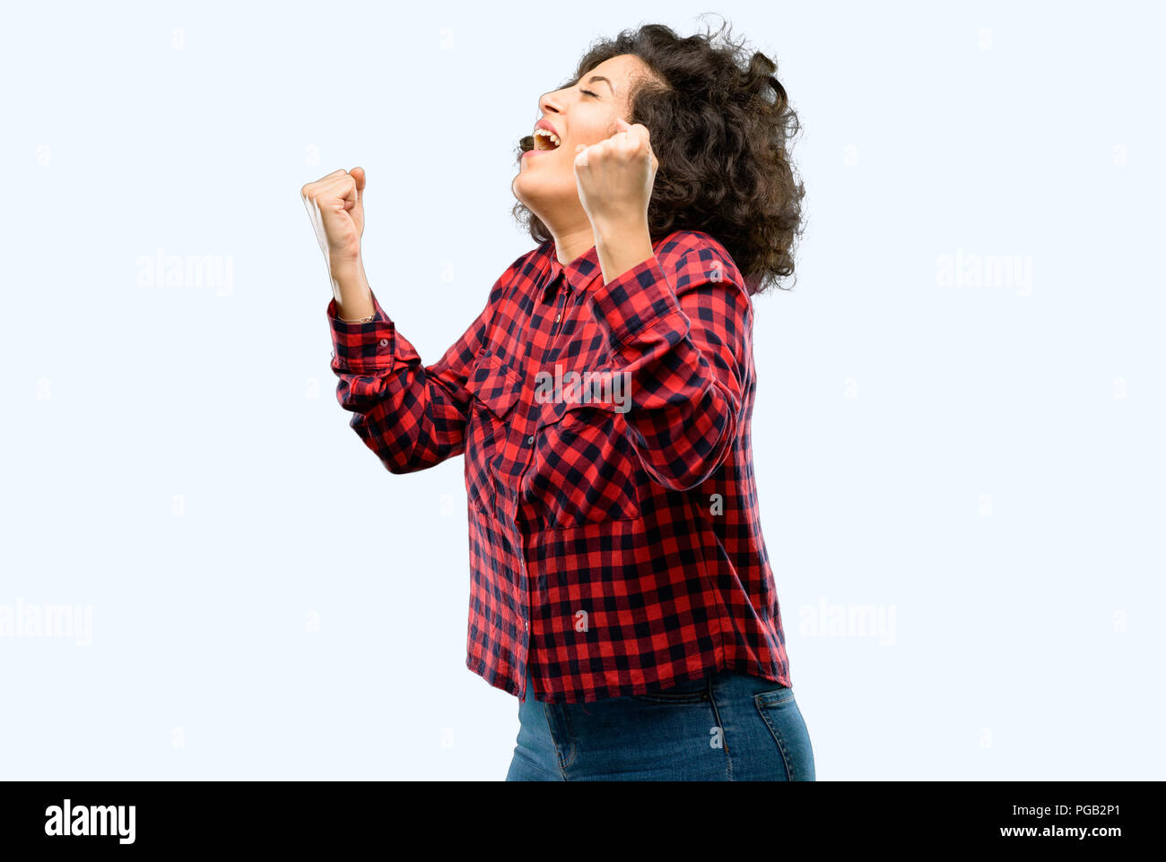 Beautiful arab woman happy and excited expressing winning gesture ...