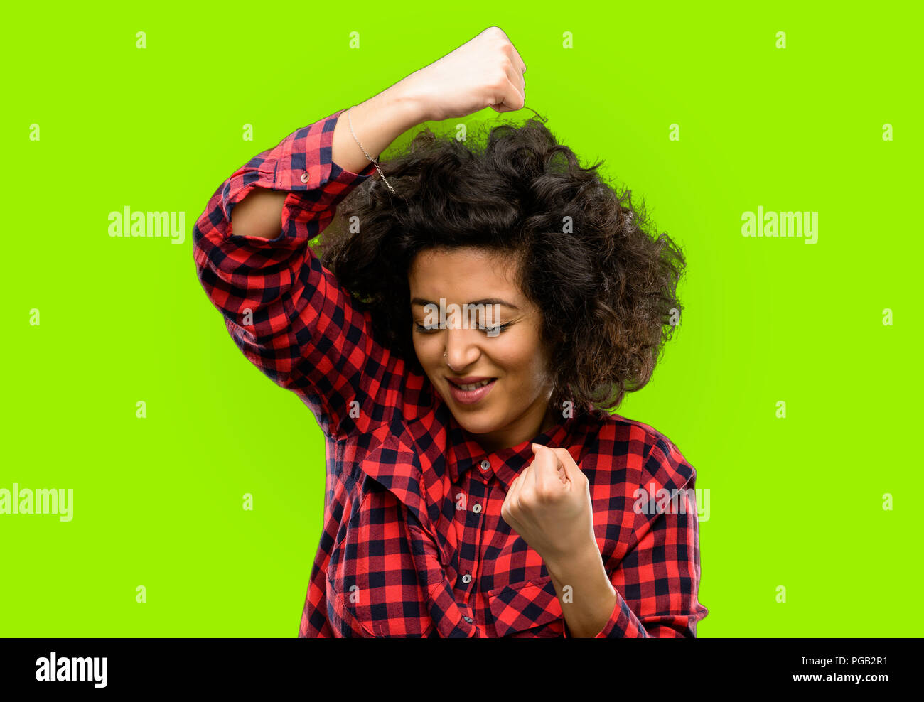Beautiful arab woman happy and excited expressing winning gesture ...