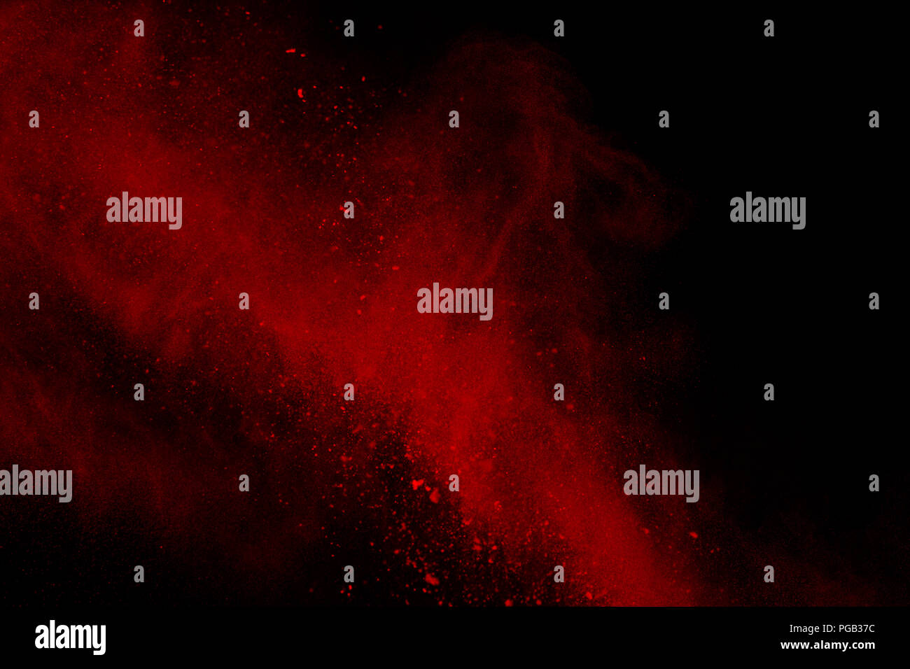 Abstract of red powder explosion on black background. Red powder ...