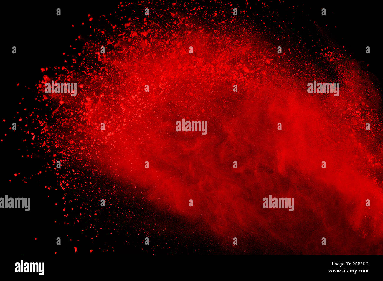 Abstract of red powder explosion on black background. Red powder ...