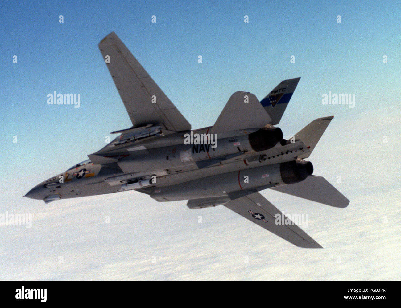 An air-to-air left underside view of an F-14A Tomcat aircraft before ...