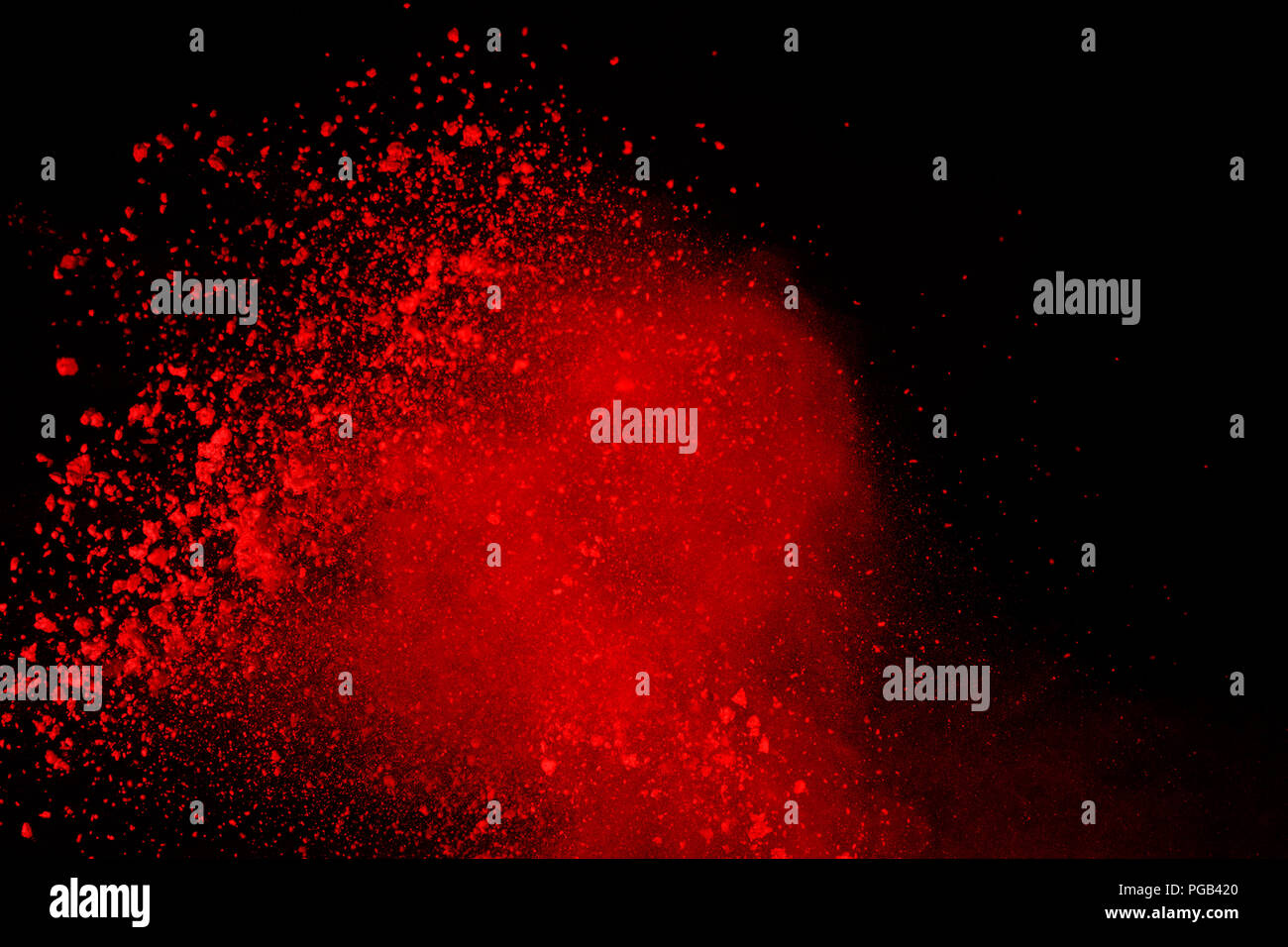 Abstract of red powder explosion on black background. Red powder ...
