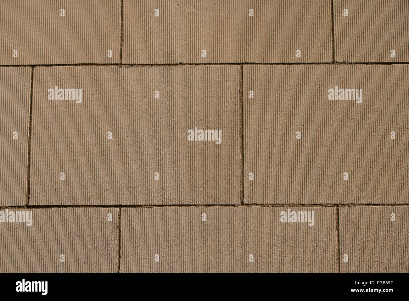 A flat shot of a brown rough block surface background texture Stock ...