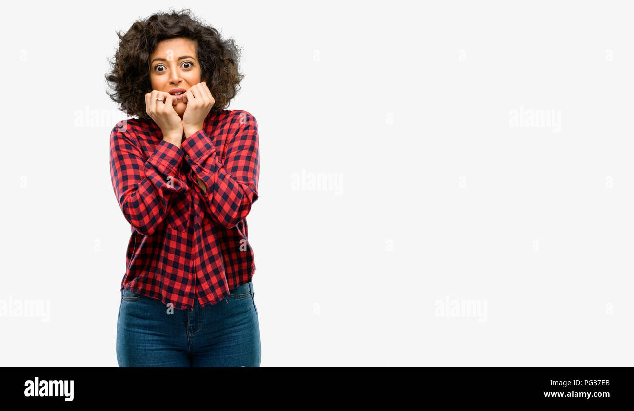 Beautiful arab woman terrified and nervous expressing anxiety and panic ...
