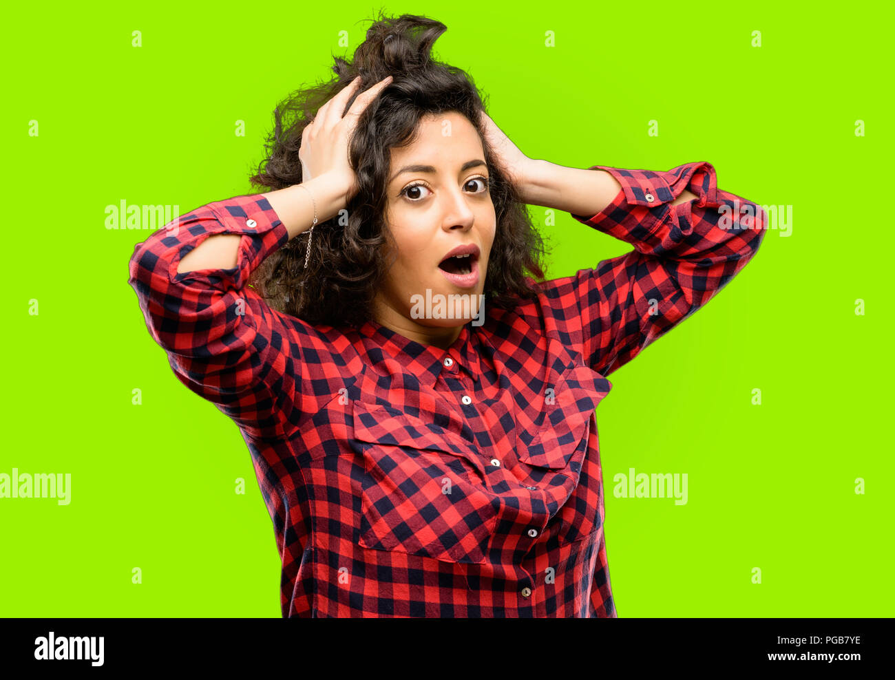 Beautiful arab woman stressful keeping hands on head, terrified in ...