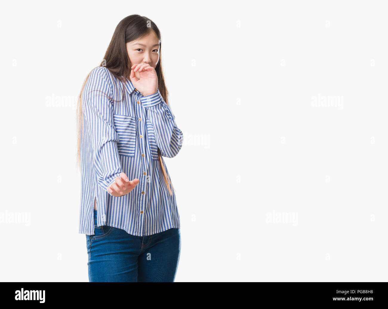 Young Chinese woman over isolated background disgusted expression ...
