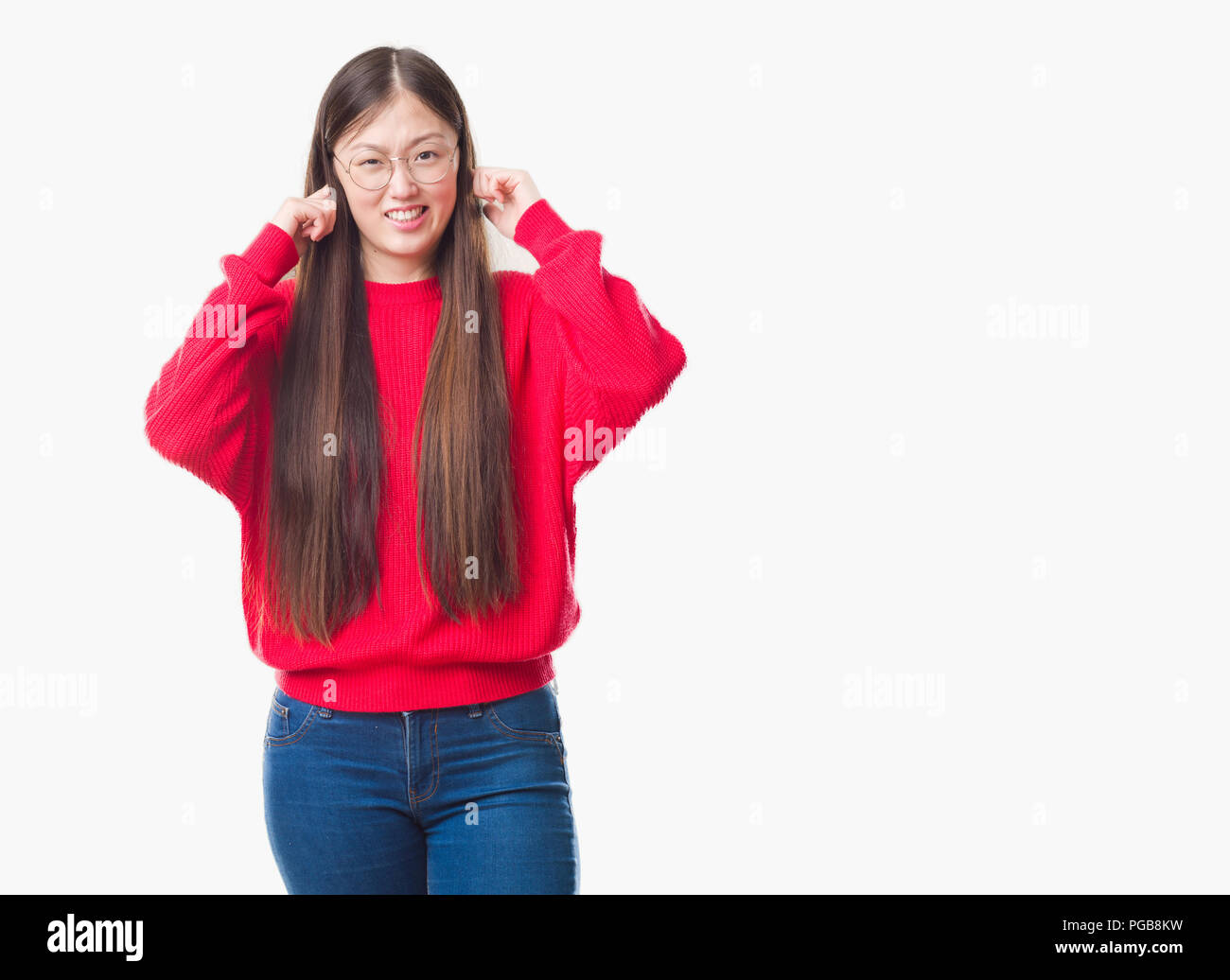 Young Chinese woman over isolated background wearing glasses covering ...