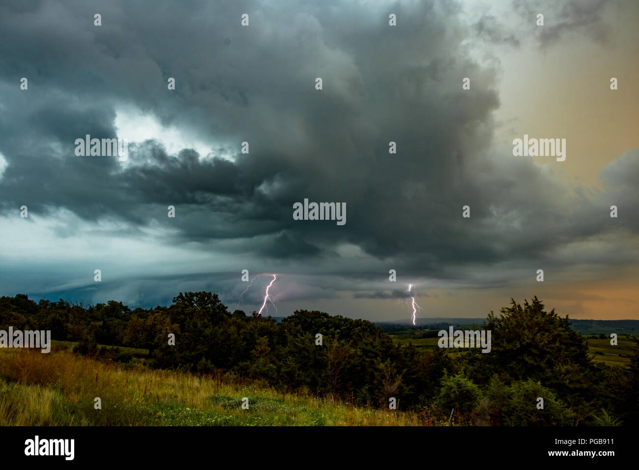 Bolts of lightning during a summer evening thunderstorm over a mid ...