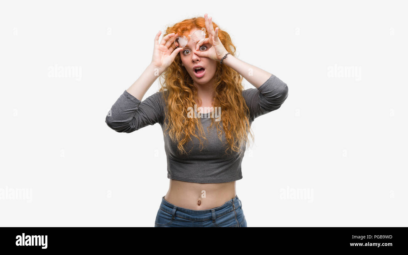 Young redhead woman doing ok gesture shocked with surprised face, eye ...