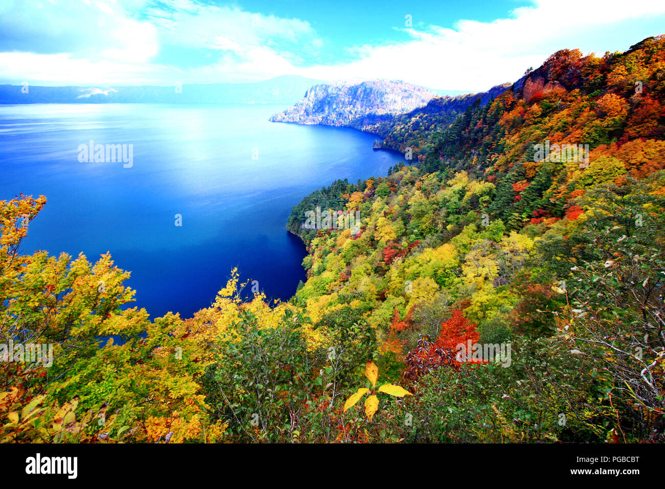 Beautiful aerial view of Lake Towada with colorful autumn foliage in ...