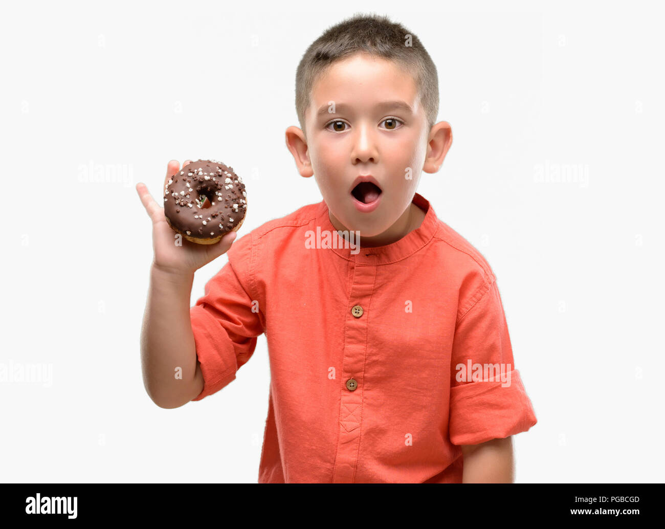 Boy eating a doughnut hi-res stock photography and images - Alamy