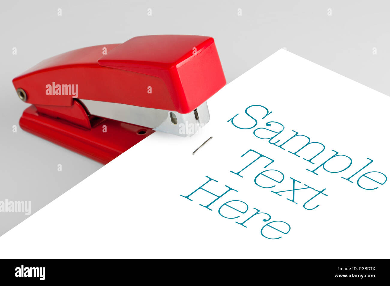 Red stapler lies on a white background Stock Photo - Alamy