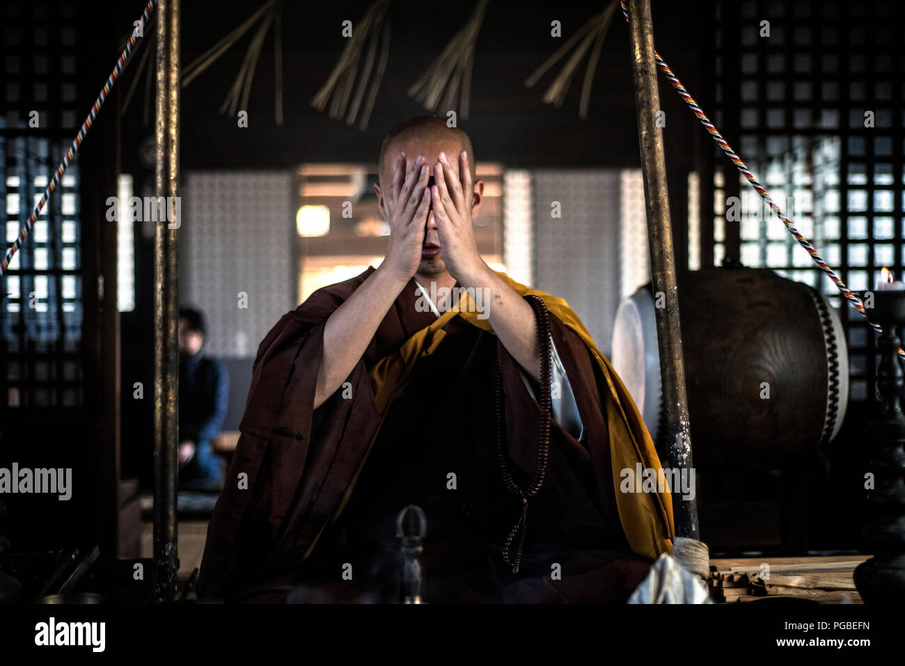 Okayama, Japan: Buddhist monk is praying in temple before fire ceremony ...