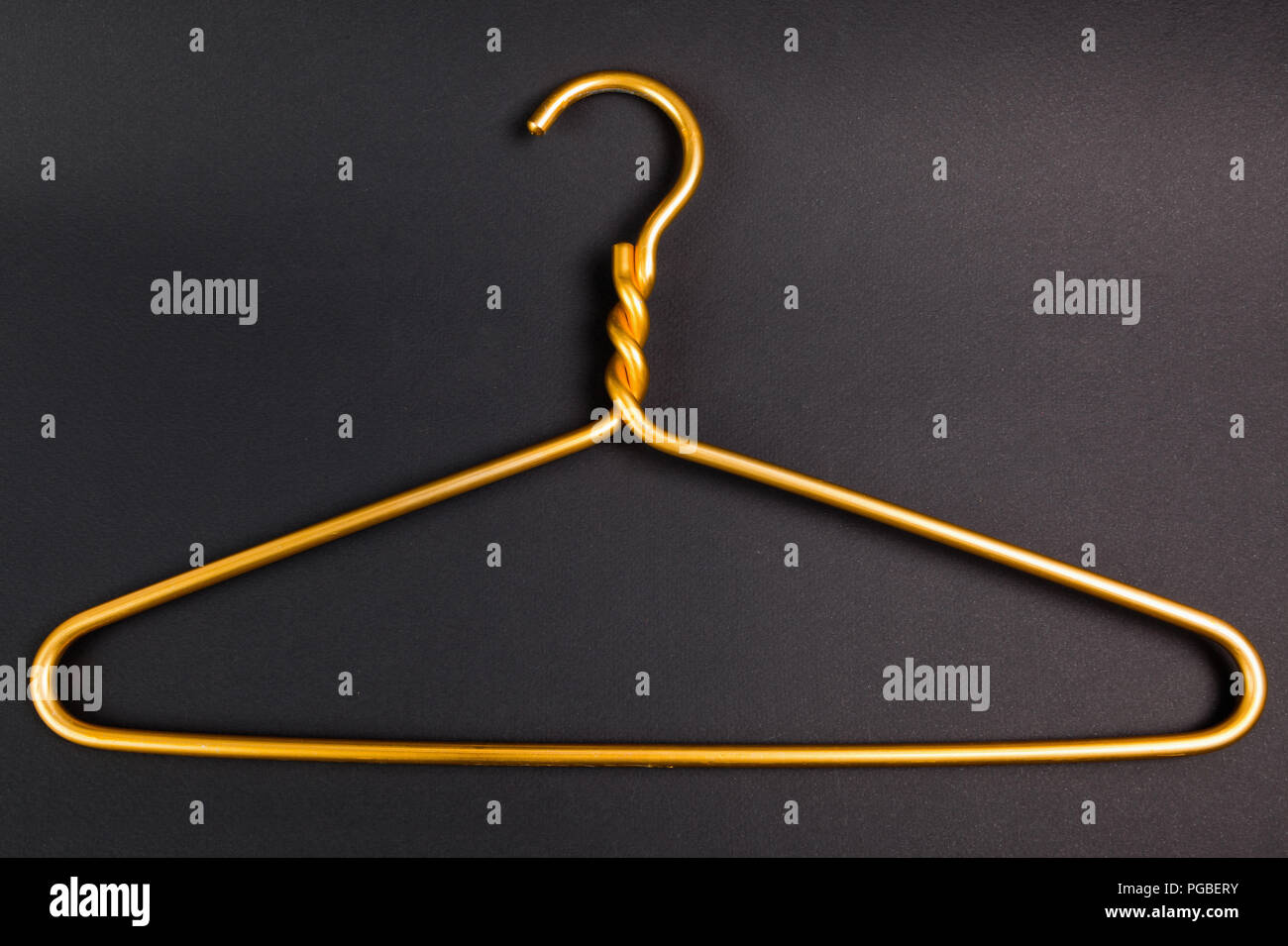 Modern yellow hanger on a black background Stock Photo - Alamy