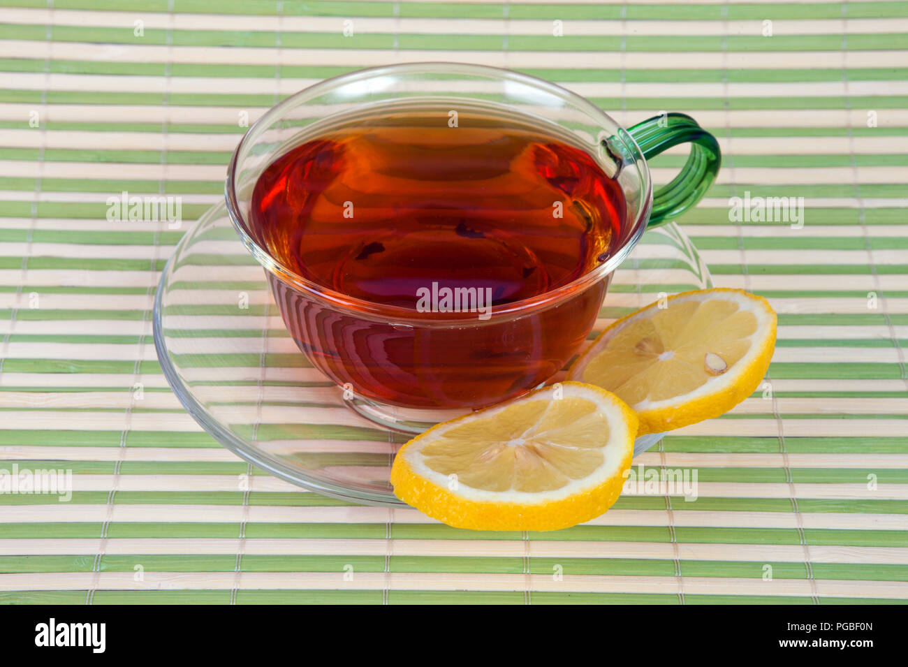 Tea with a lemon in a glass cup Stock Photo - Alamy