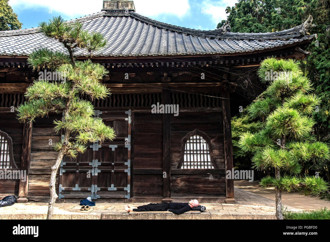 Okayama, Japan: Buddhist monk is pointing to temple for ceremony on ...