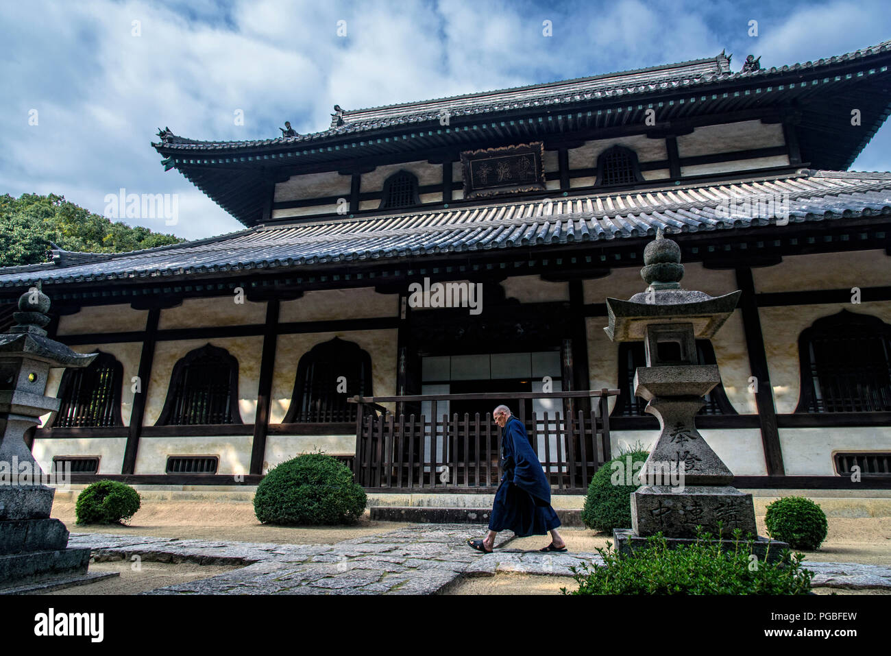 Okayama, Japan: Buddhist monk is walking in front if Buddhist temple ...