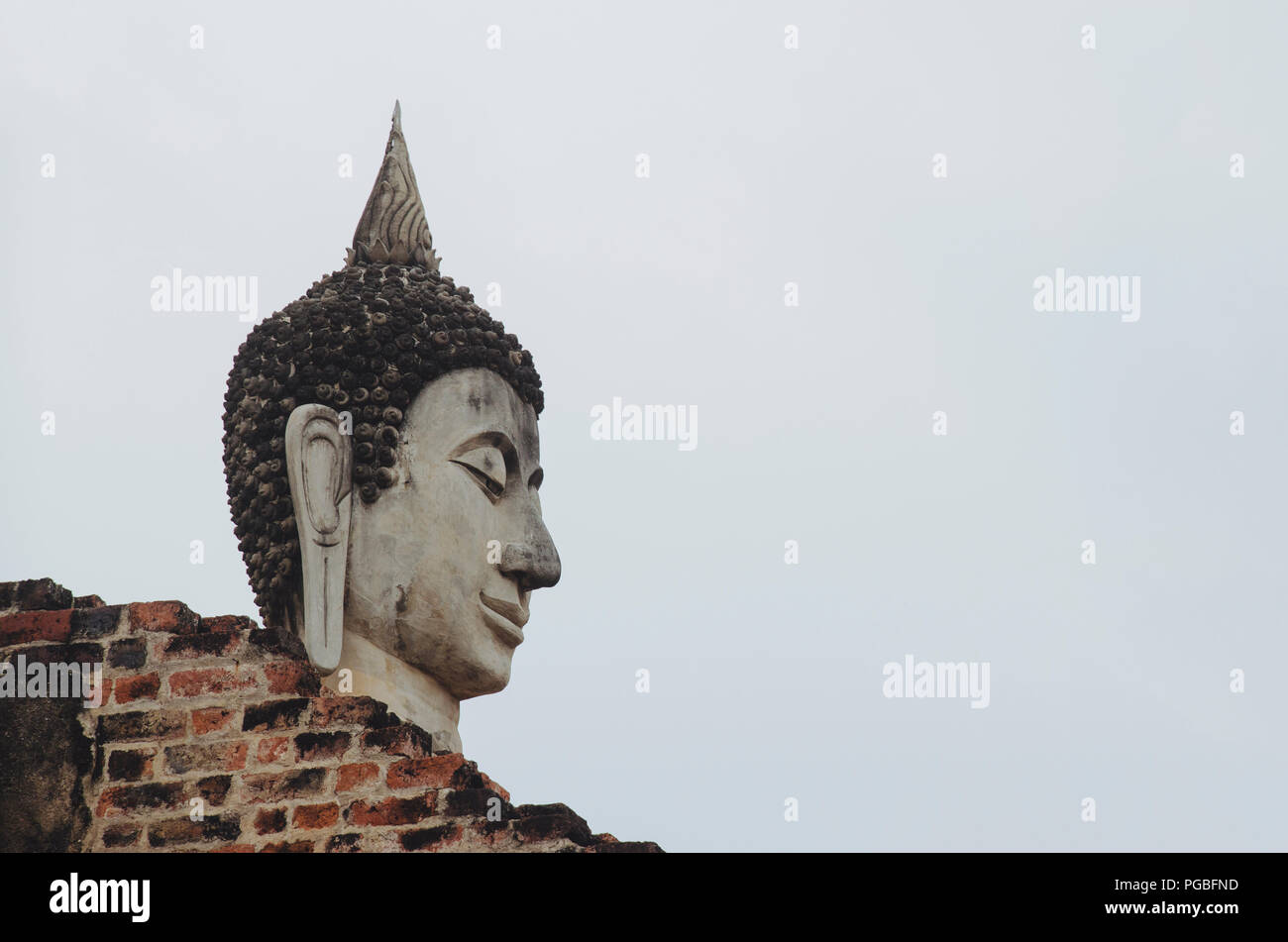 Carved stone Buddha statue; wat/temple complex in old Siam kingdom ...