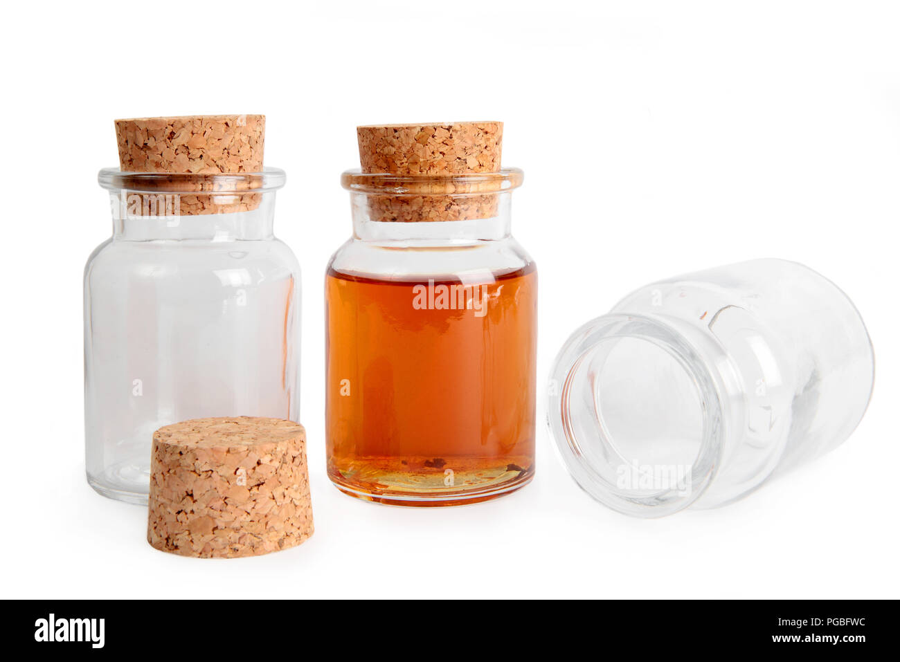 Empty and full glass bottle with cork Stock Photo - Alamy