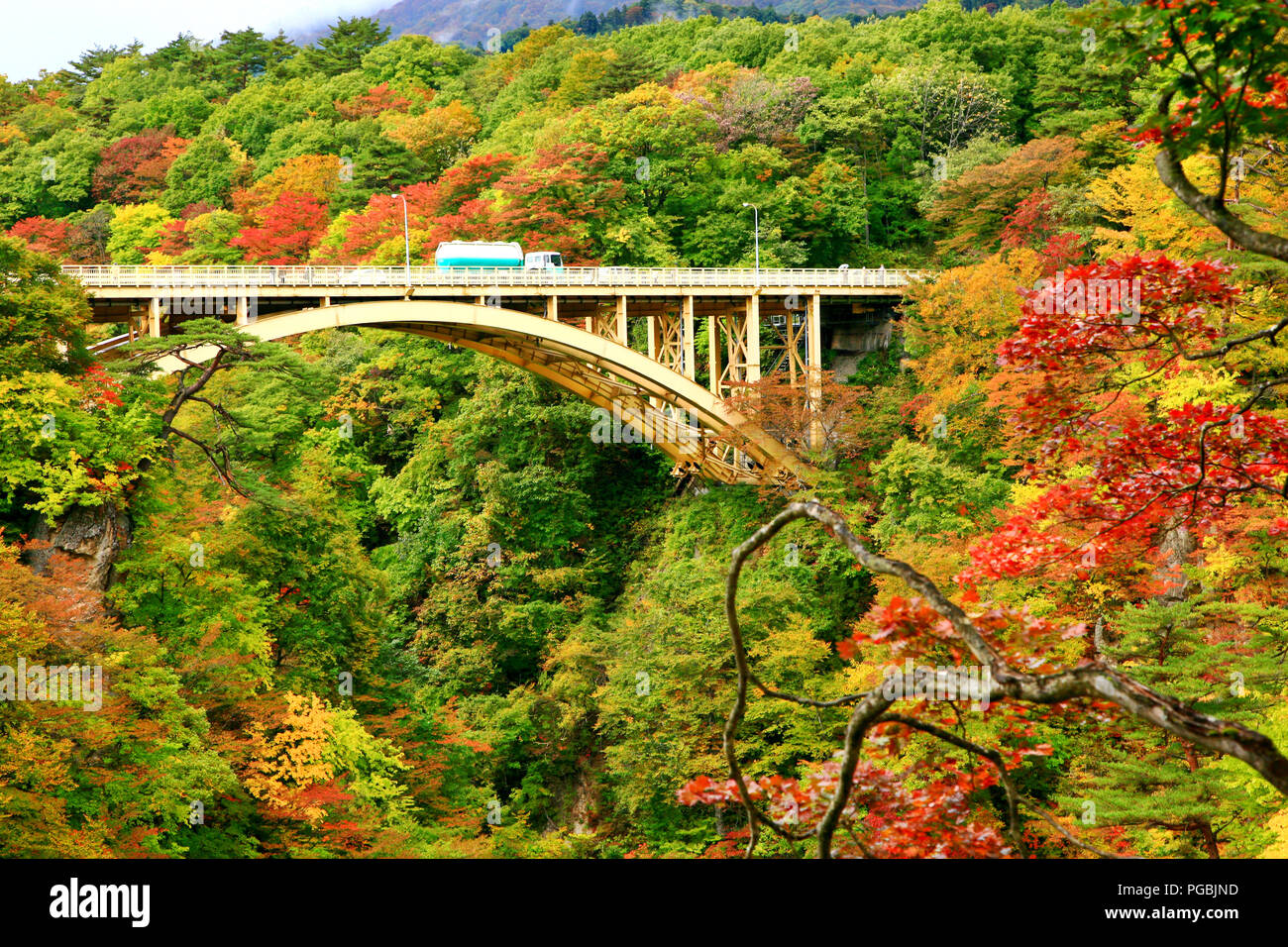 Beautiful view of a highway bridge spanning across colorful autumn ...
