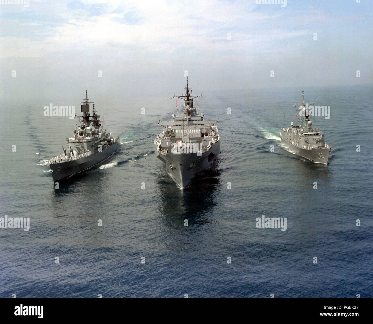 Officers and sailors man the rails of the amphibious command ship USS ...