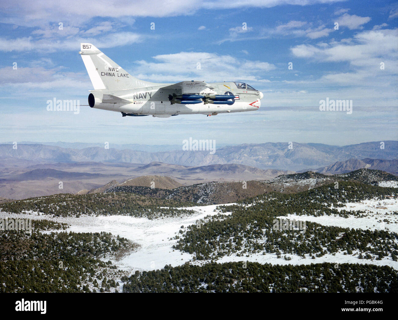 An air-to-air right side view of an A-7E Corsair II aircraft loaded ...