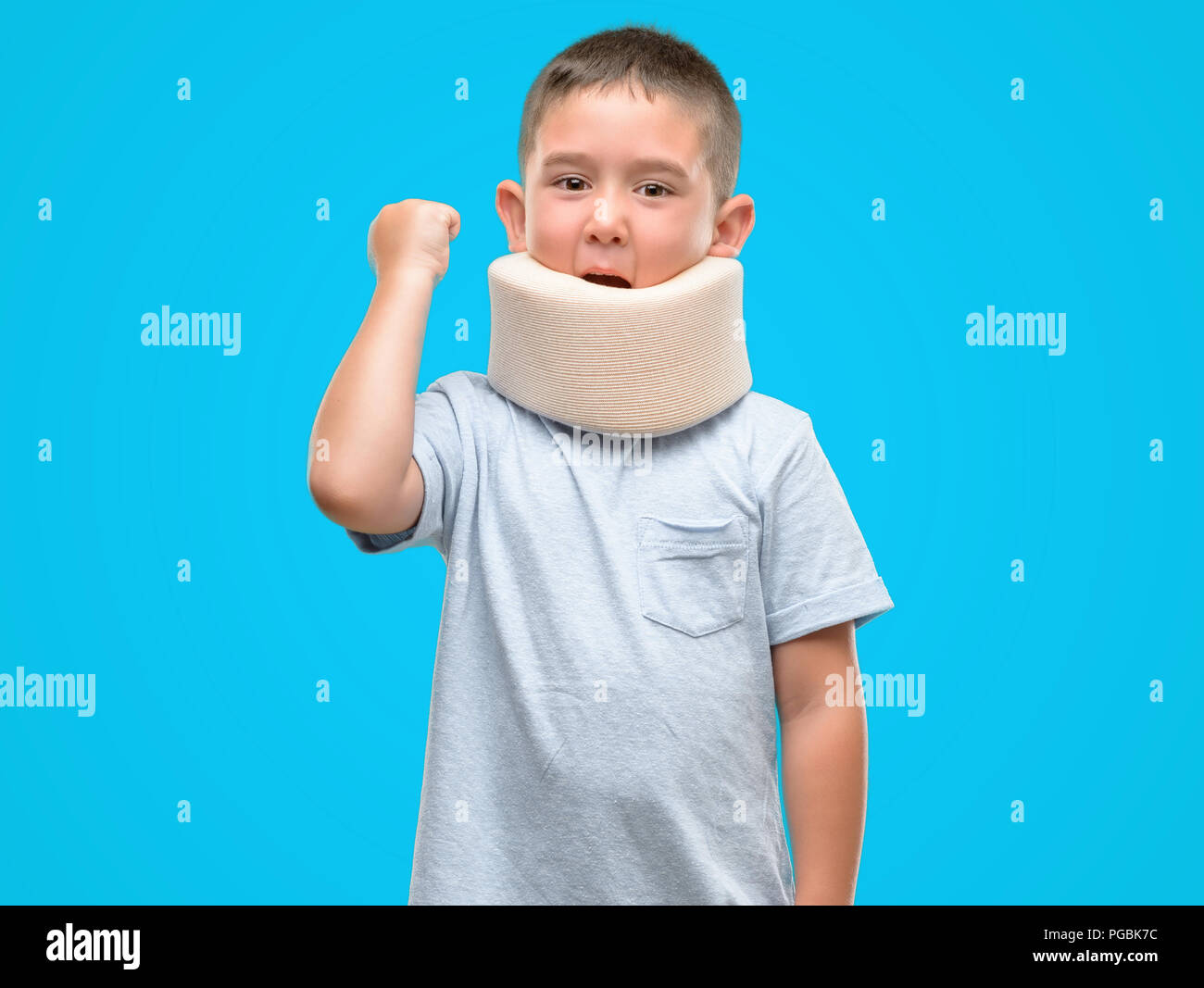 Dark haired little child injured wearing neck collar annoyed and ...