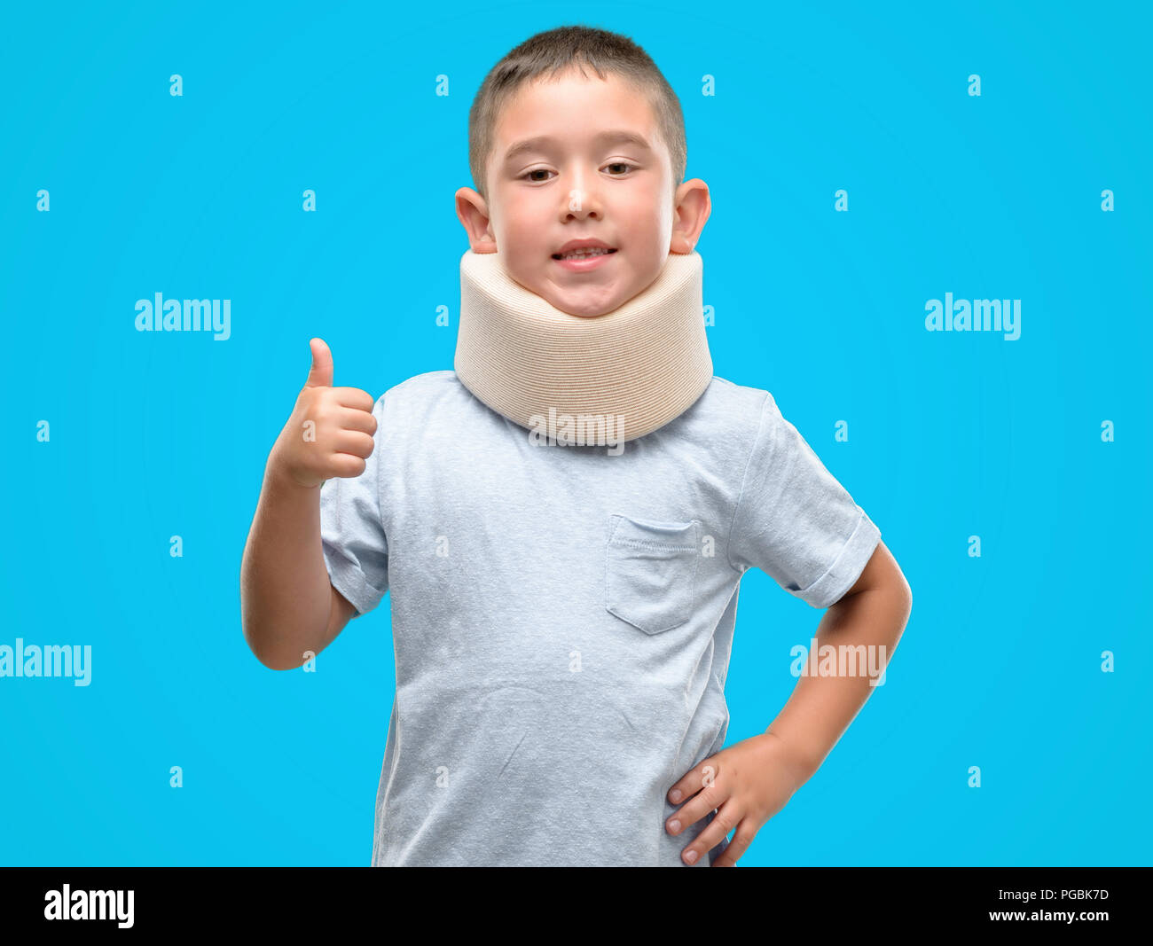 Dark haired little child injured wearing neck collar happy with big ...