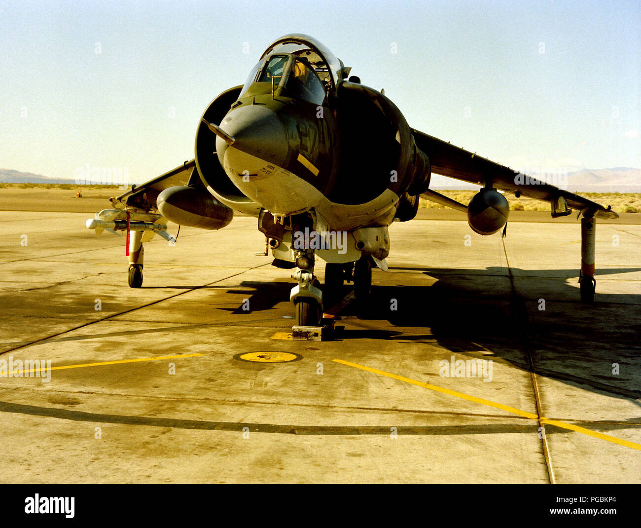 A front view of a Marine AV-8 Harrier aircraft with an AIM-9 Sidewinder ...