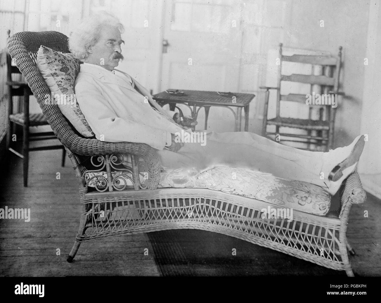Samuel Clemens (Mark Twain) reclining in porch chair 4 15 1910 Stock ...