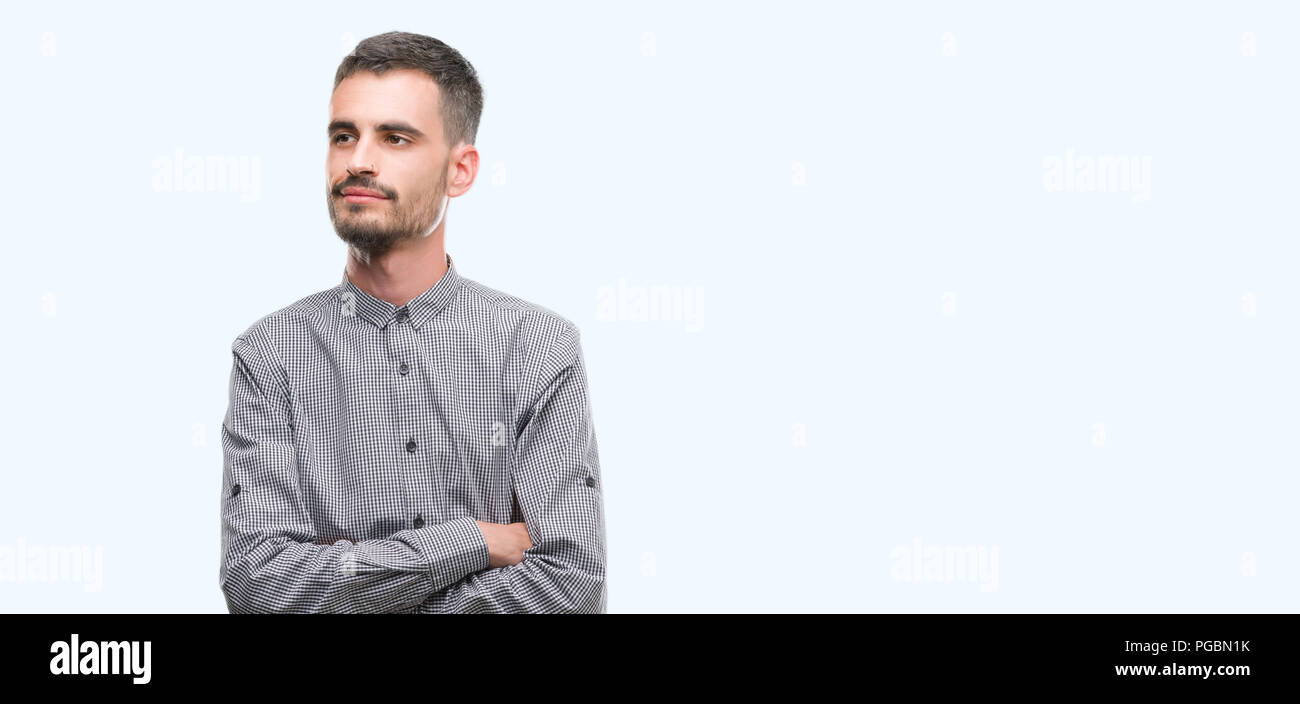 Young hipster man smiling looking side and staring away thinking Stock ...