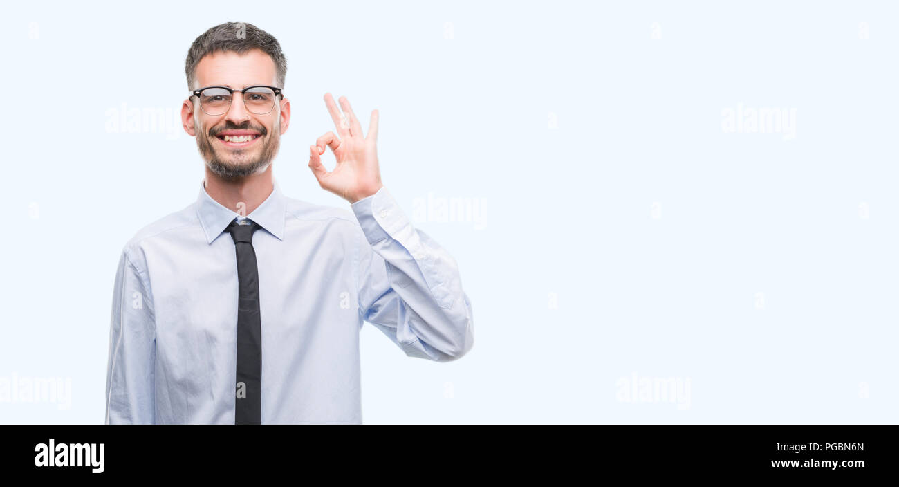 Young business man doing ok sign with fingers, excellent symbol Stock ...