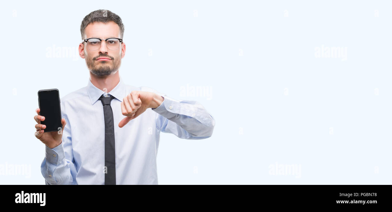 Young business adult man talking on the phone with angry face, negative ...