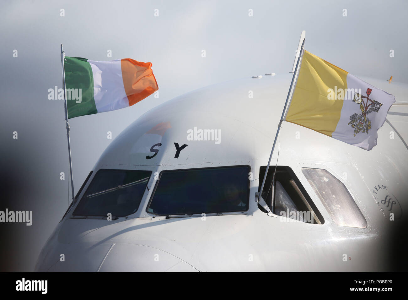 Flags are flown from the plane carrying Pope Francis as it arrives at ...