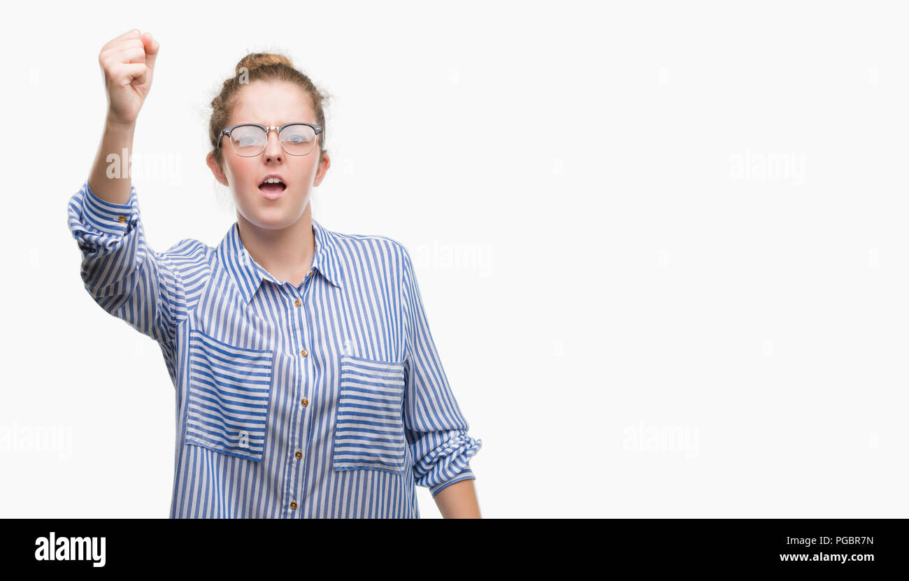 Angry young woman raising hand hi-res stock photography and images - Alamy