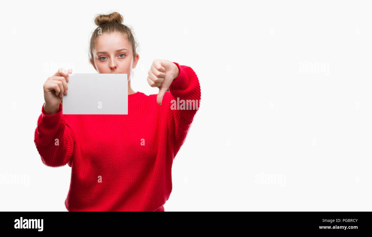 Young blonde woman holding advertising banner with angry face, negative ...