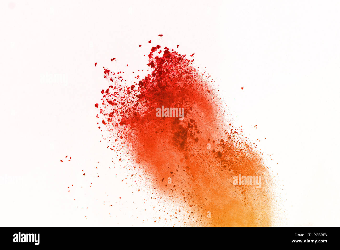 Abstract of colored powder explosion on white background. Orange powder ...