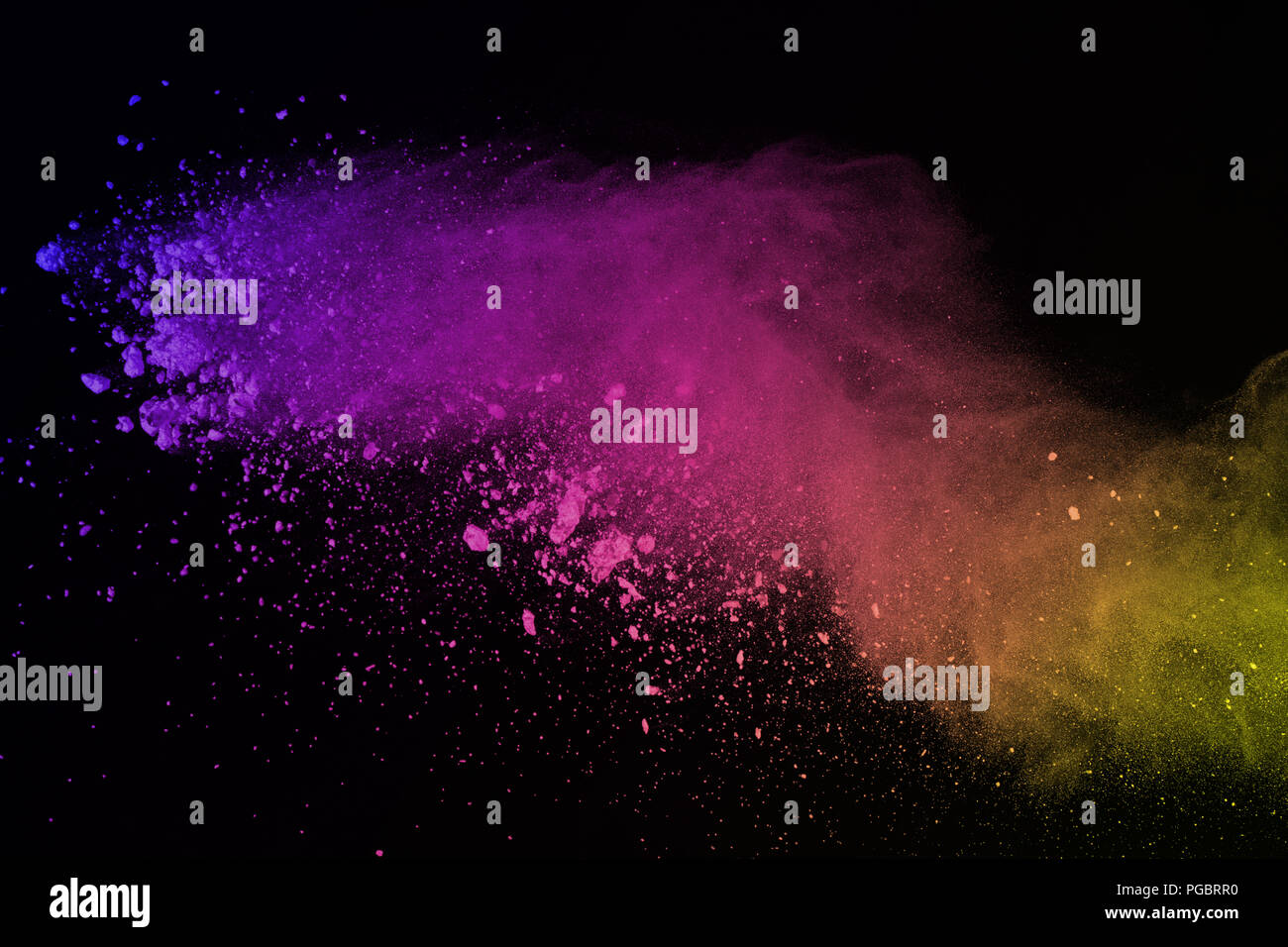Freeze motion of colored powder explosion isolated on black background ...