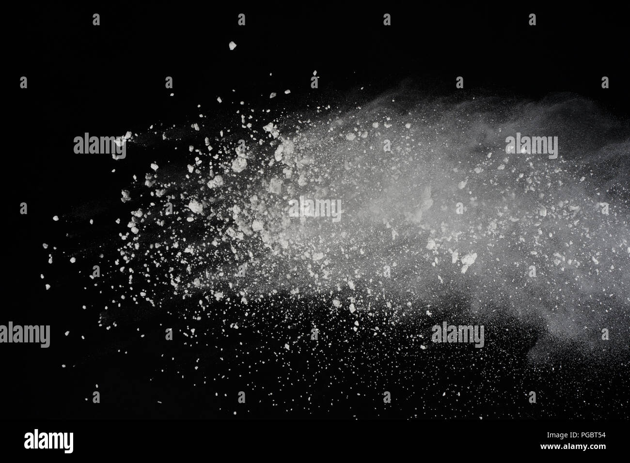 White powder explosion isolated on black background. Colored dust ...