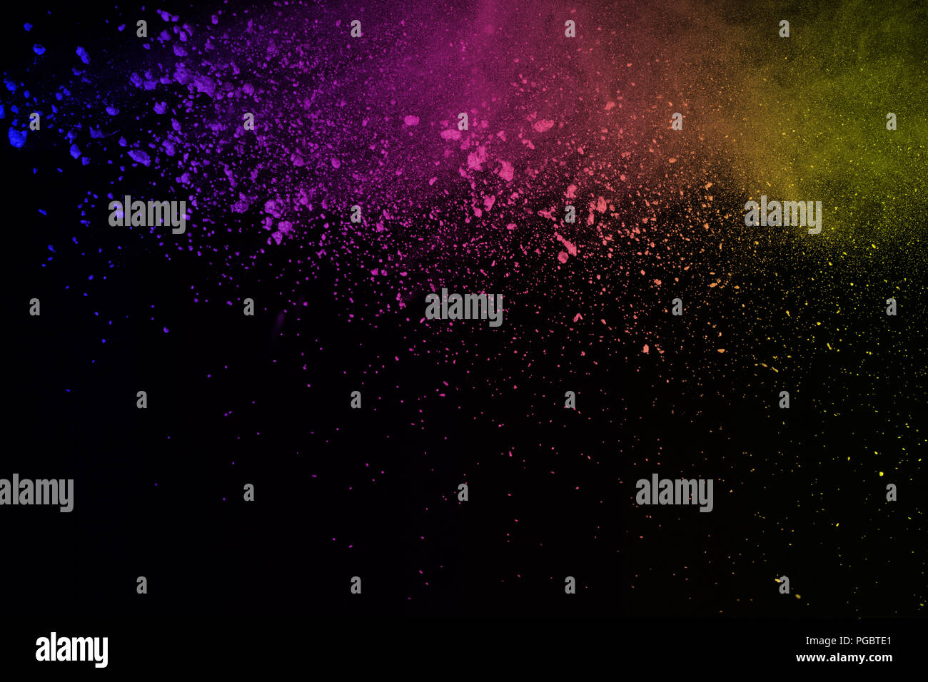 Freeze motion of colored powder explosion isolated on black background ...