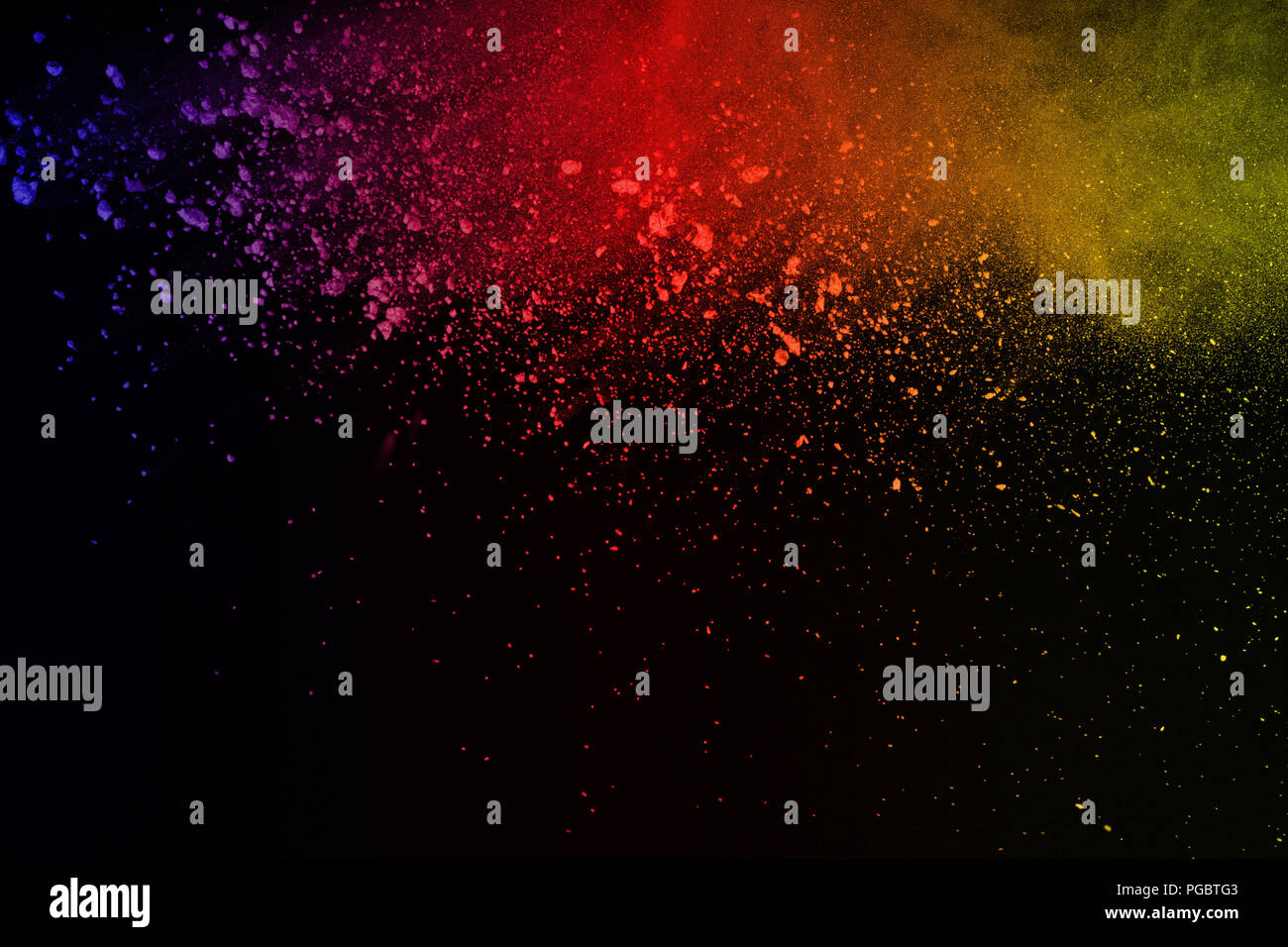 Freeze motion of colored powder explosion isolated on black background ...