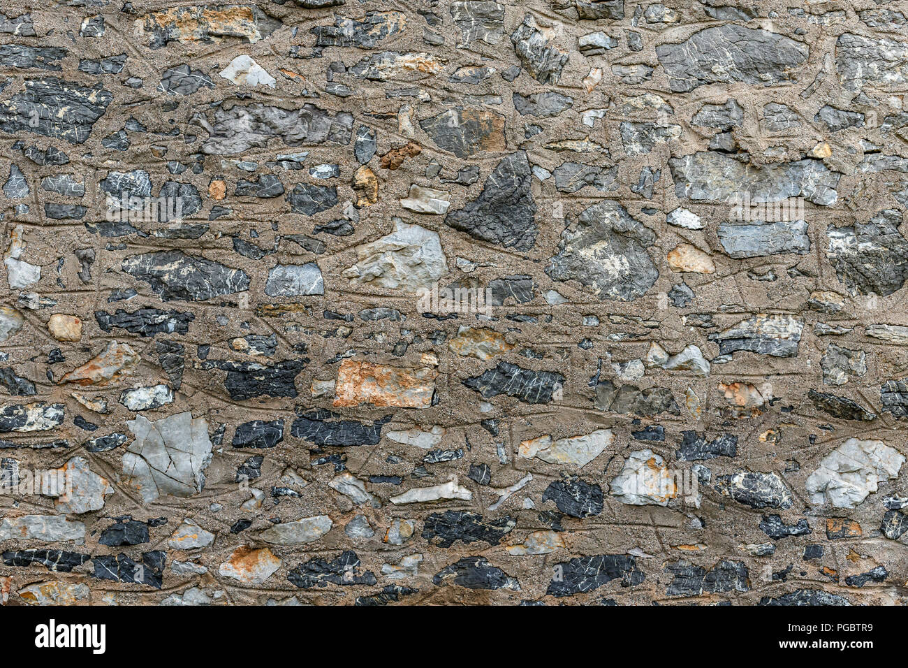 Uneven stone wall for texture or background Stock Photo - Alamy