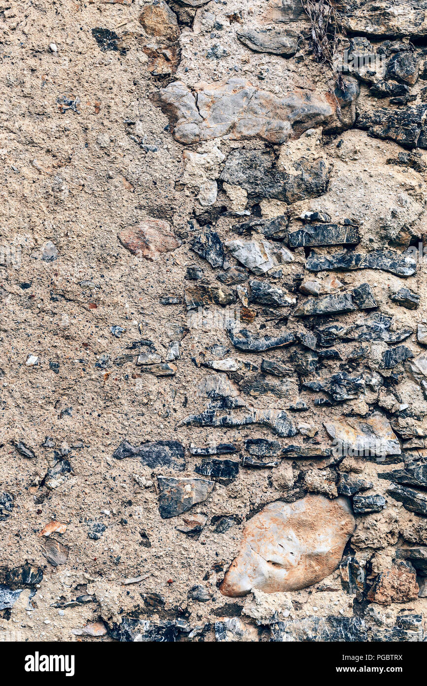 Uneven stone wall for texture or background Stock Photo - Alamy