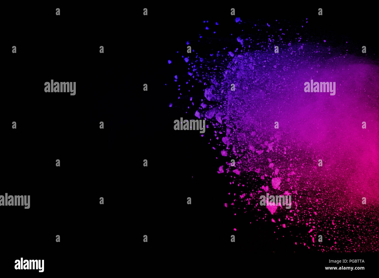 Freeze motion of colored powder explosion isolated on black background ...