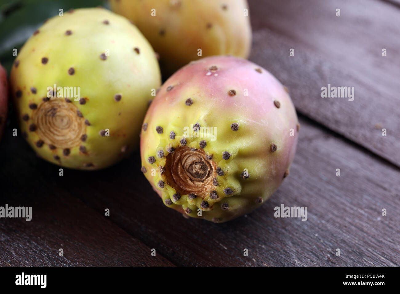 Fruits of the prickly pear cactus on a rustic table Stock Photo - Alamy